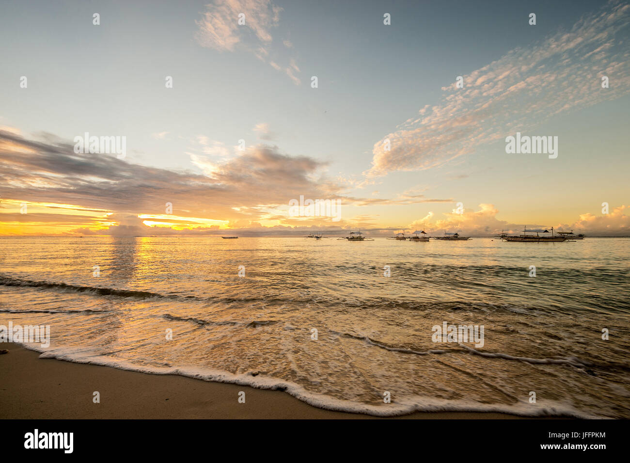 Tropical beach sunset at Philippines Stock Photo - Alamy