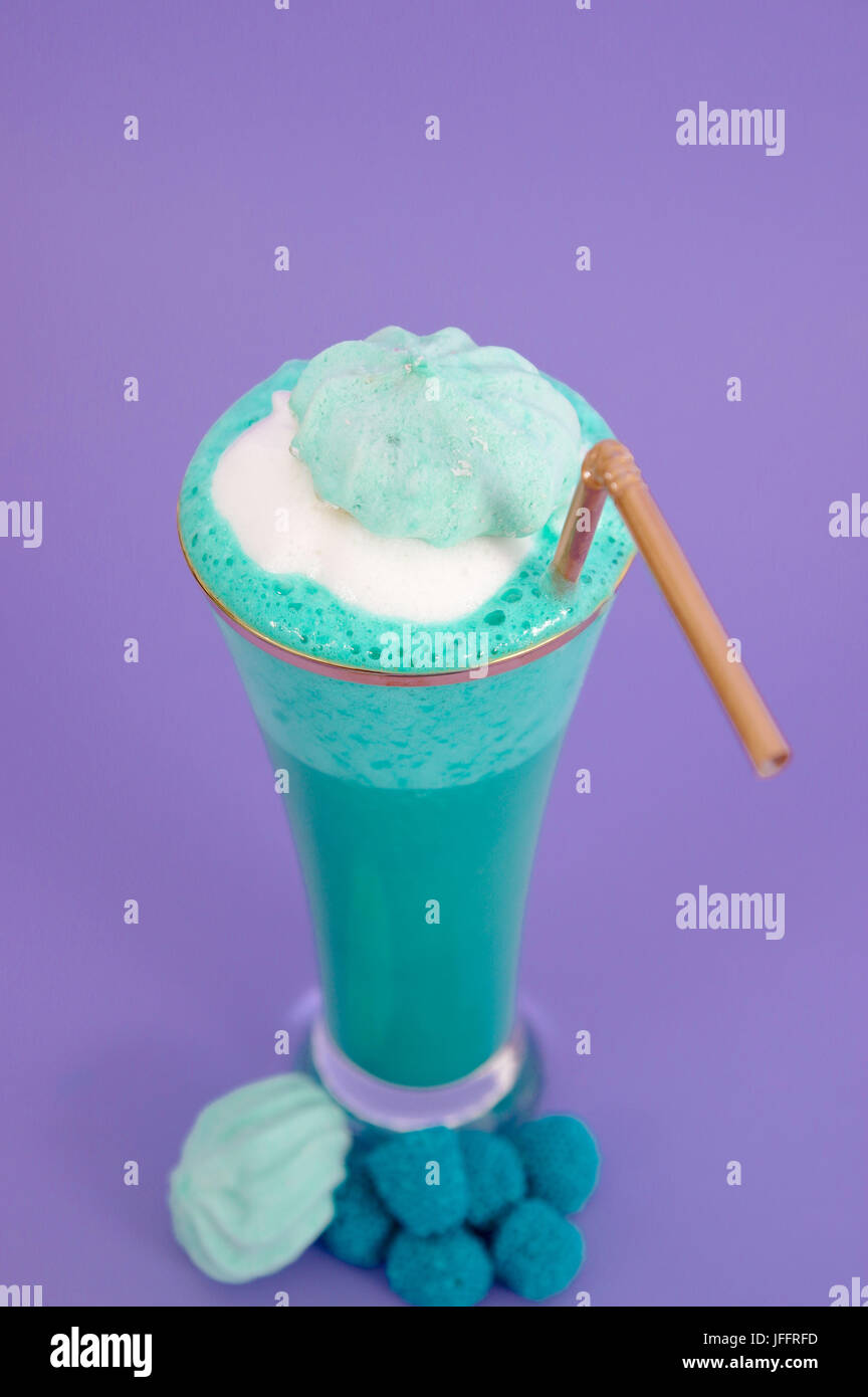 Delicious homemade extreme milkshake with milk foam on top with a ...