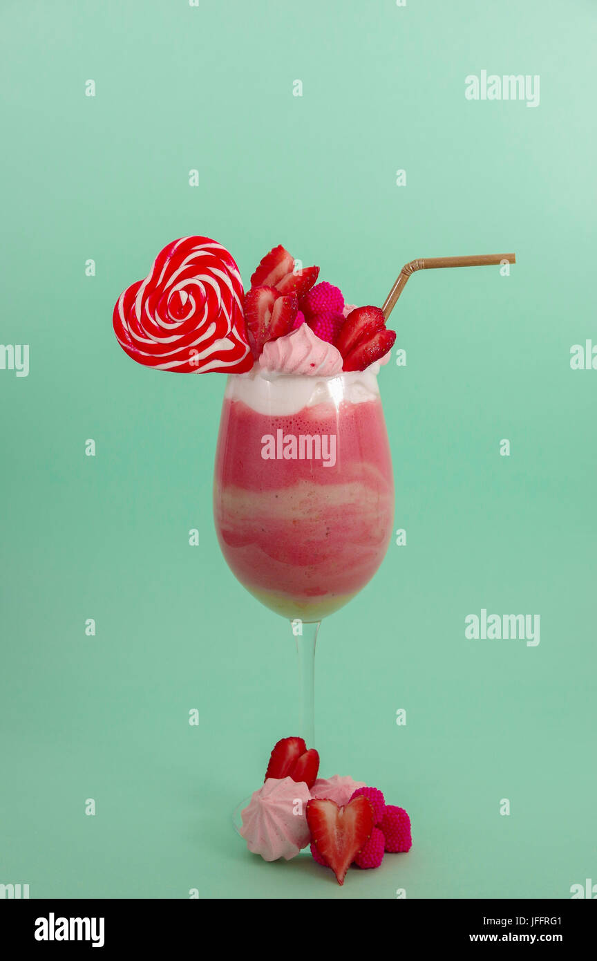 Delicious homemade extreme milkshake of strawberry with milk foam with ...