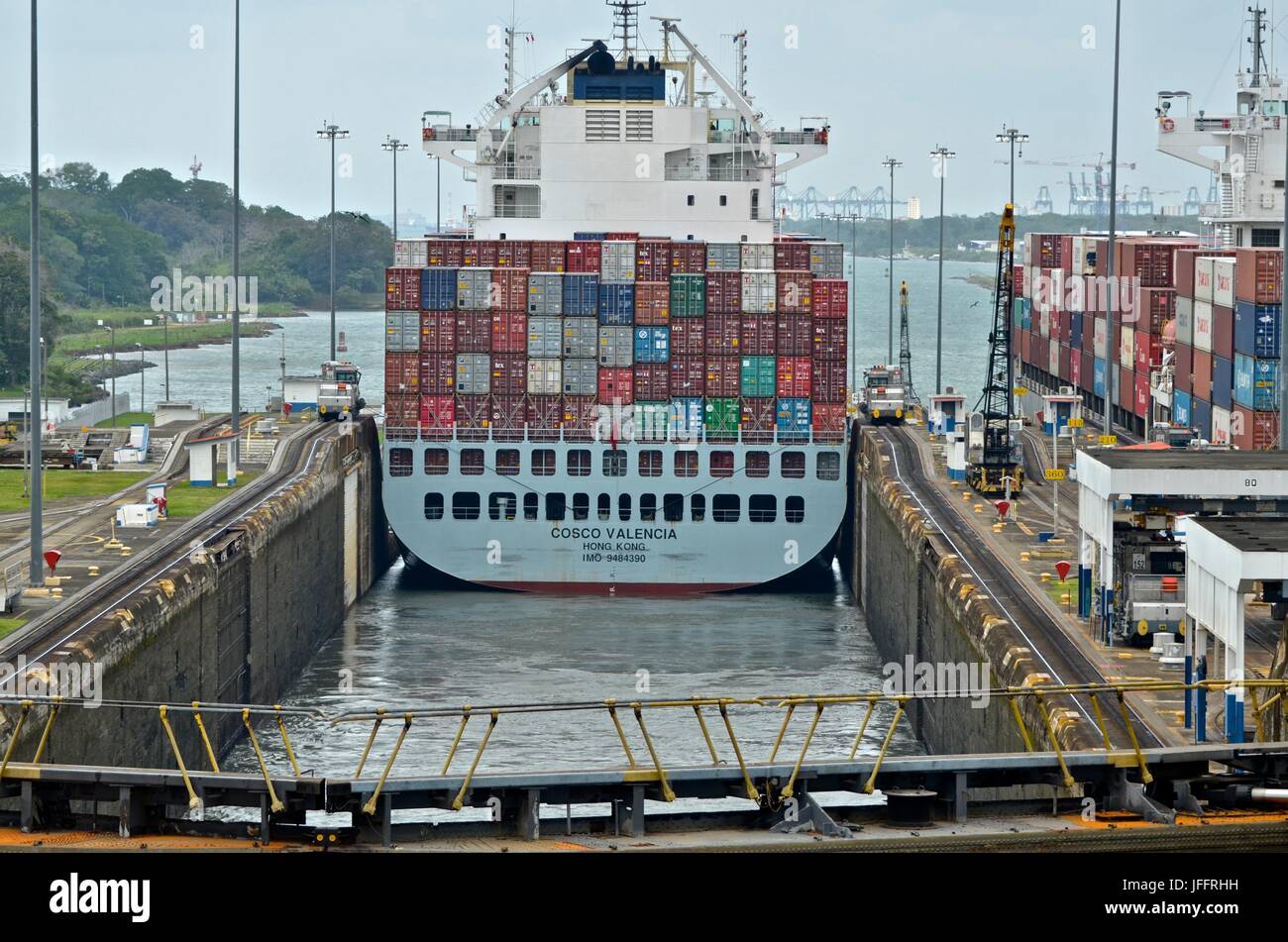 A cargo ship with containers crosses the Panama canal Stock Photo - Alamy