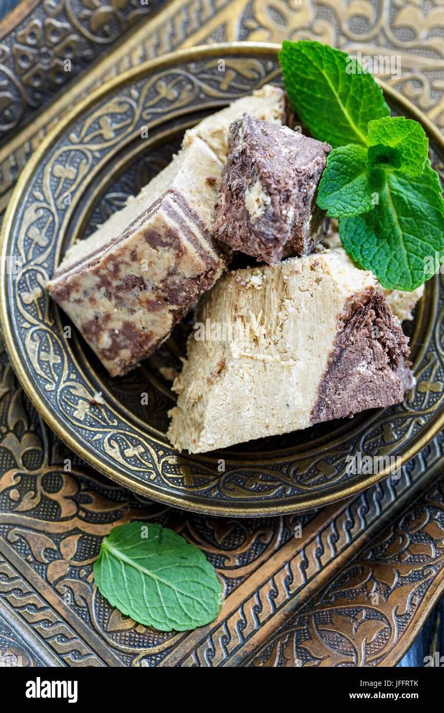 Tahini halva with chocolate and mint in a bronze plate Stock Photo - Alamy
