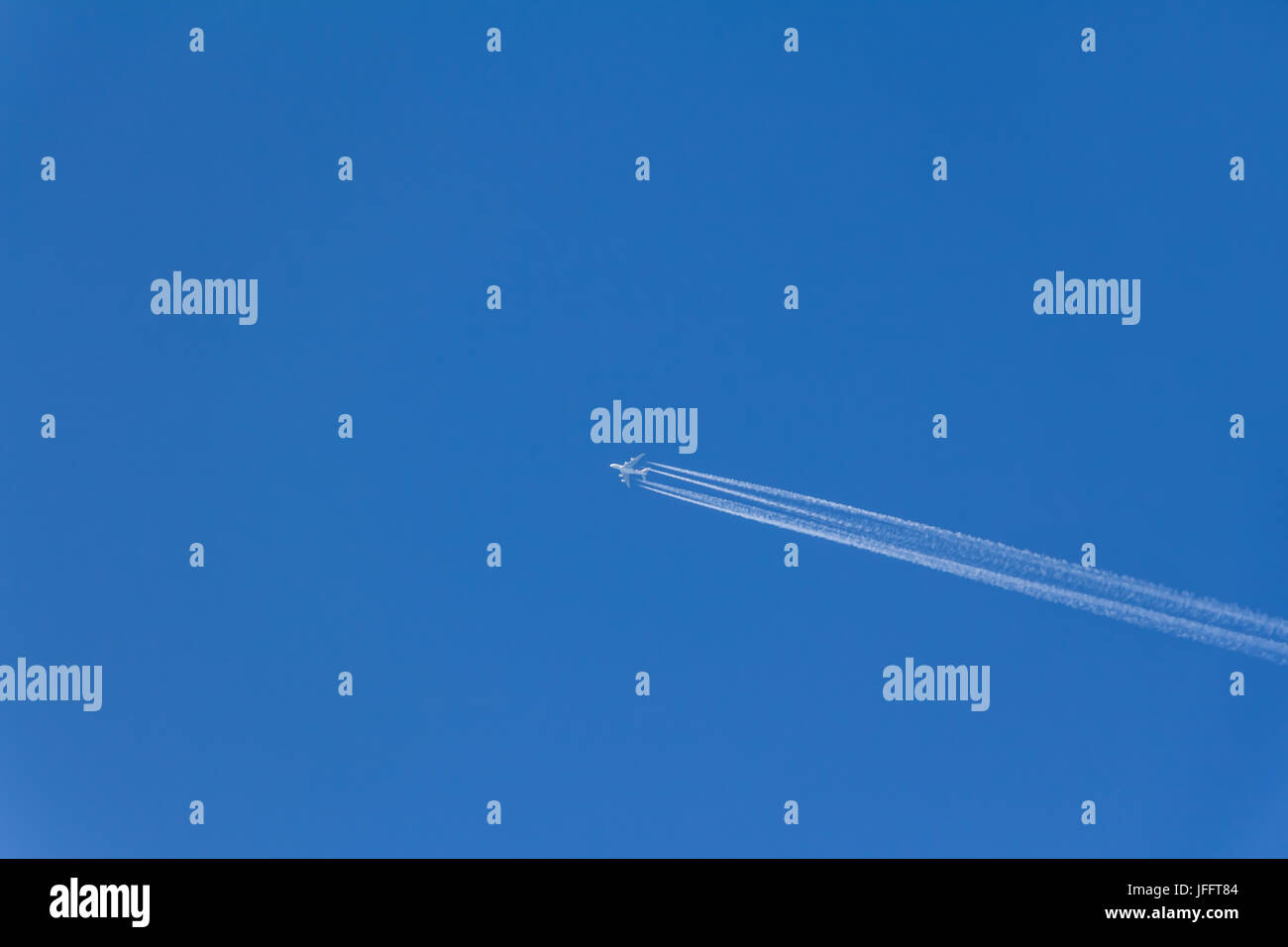 Airliner flying high Stock Photo - Alamy