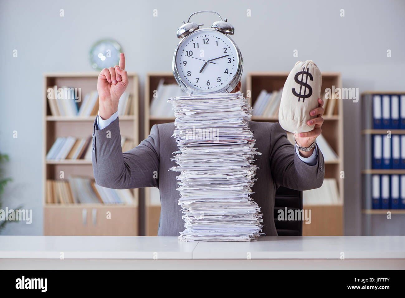 Businessman busy with paperwork in office Stock Photo - Alamy