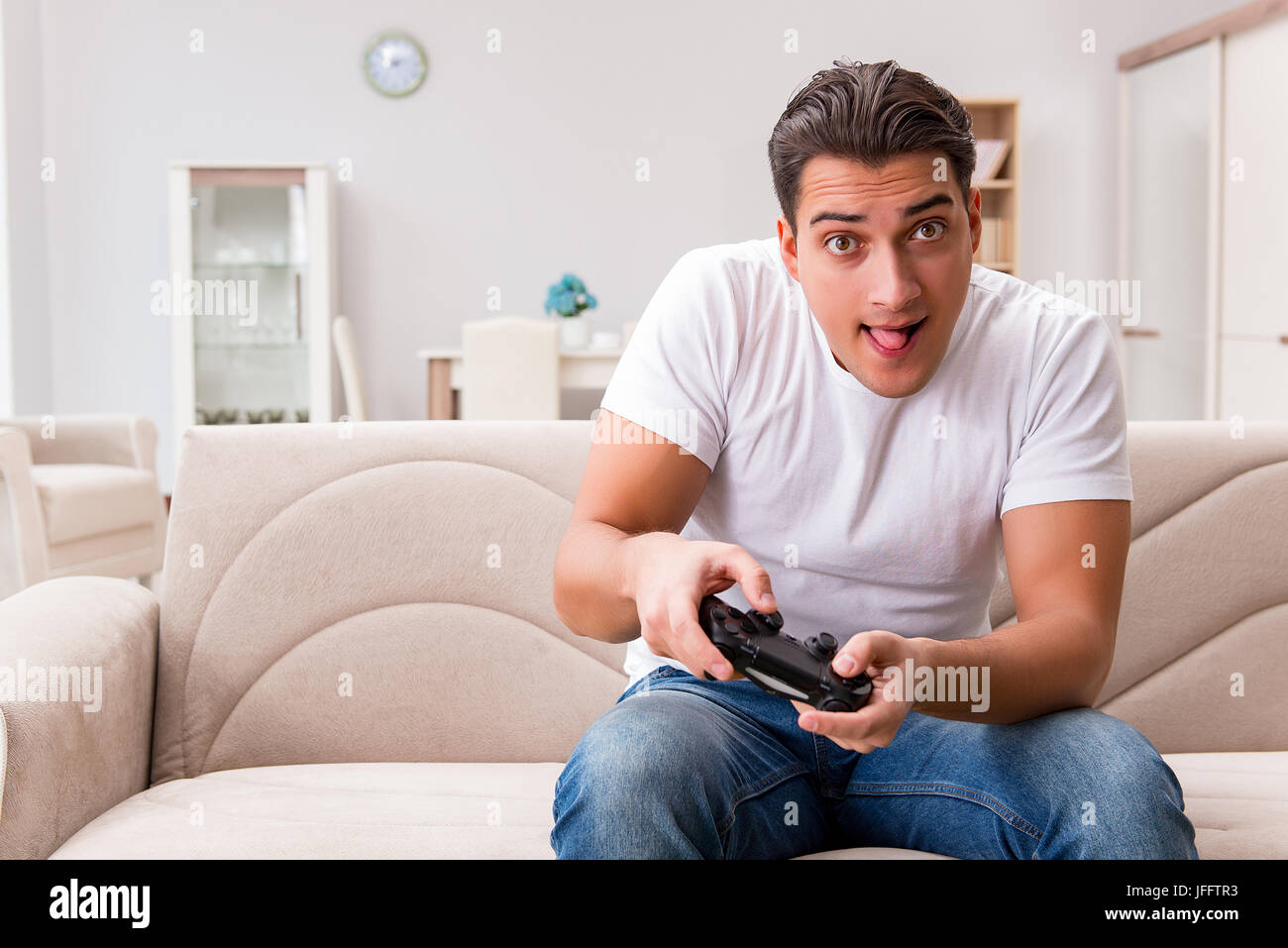 Man addicted to computer games Stock Photo - Alamy