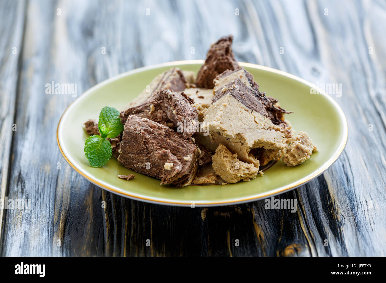 Plate with tahini halva with chocolate and mint Stock Photo - Alamy