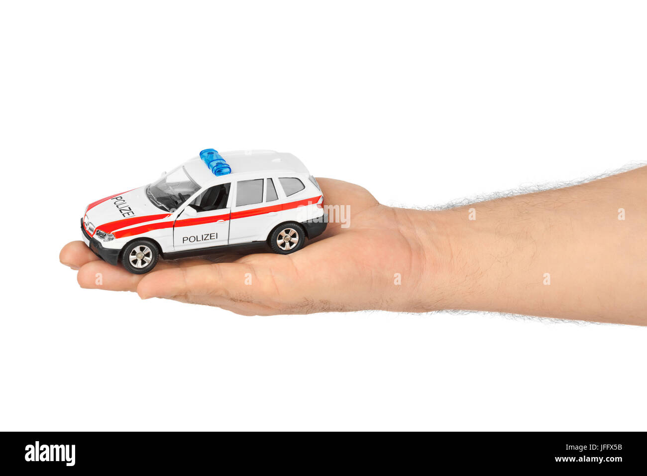 Hand with toy police car Stock Photo - Alamy