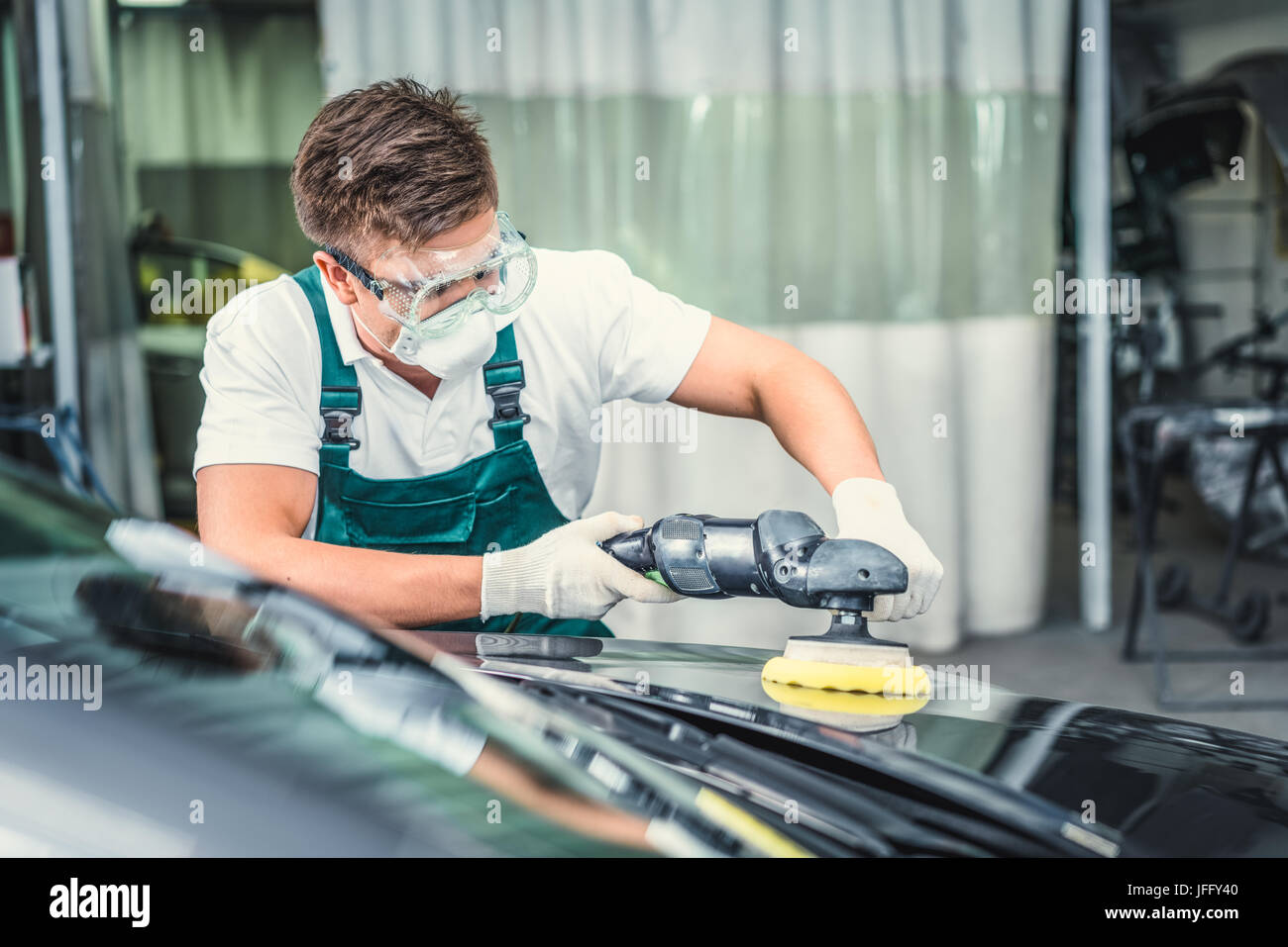 Man in garage Stock Photo - Alamy