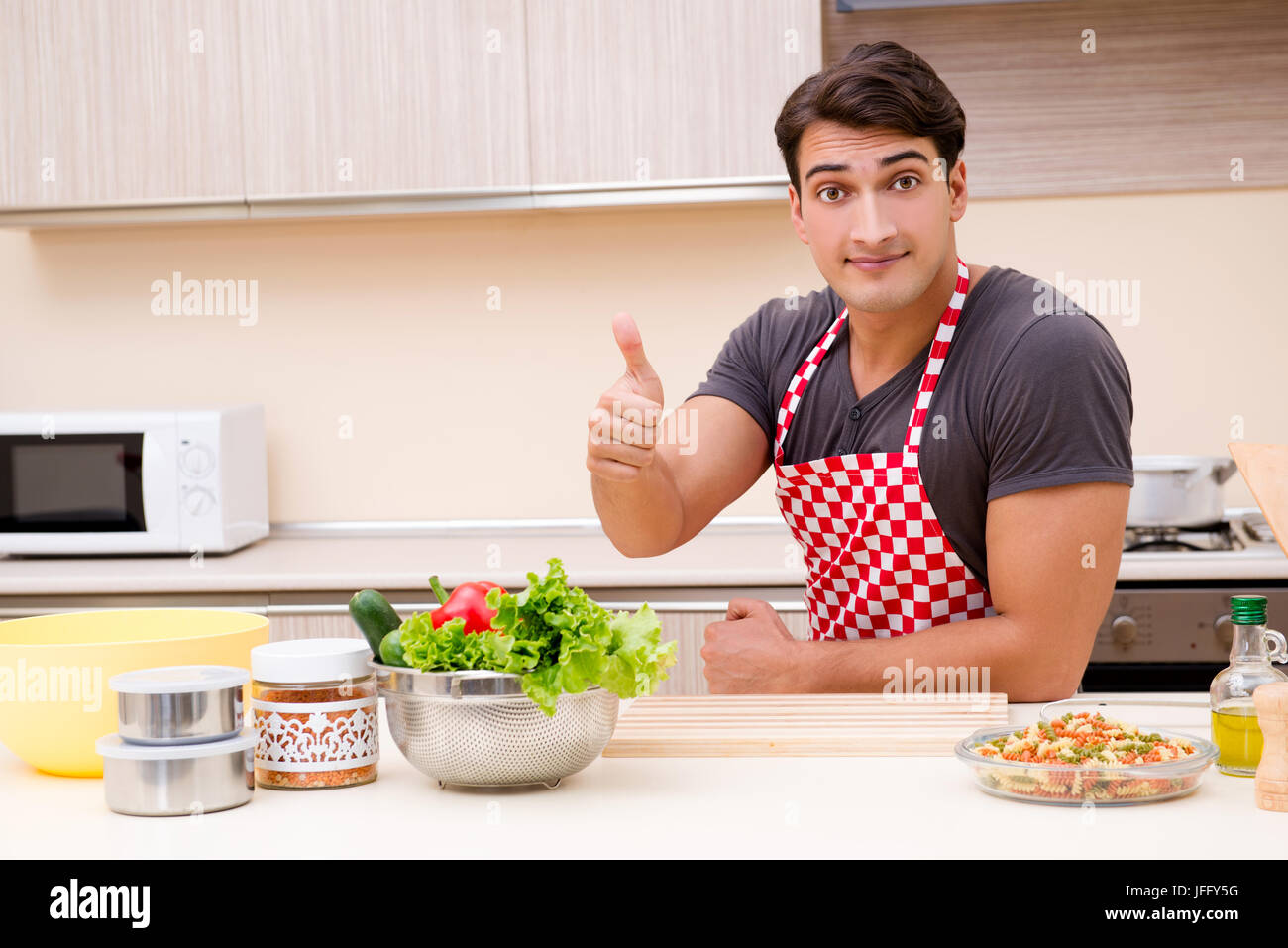Man male cook preparing food in kitchen Stock Photo - Alamy