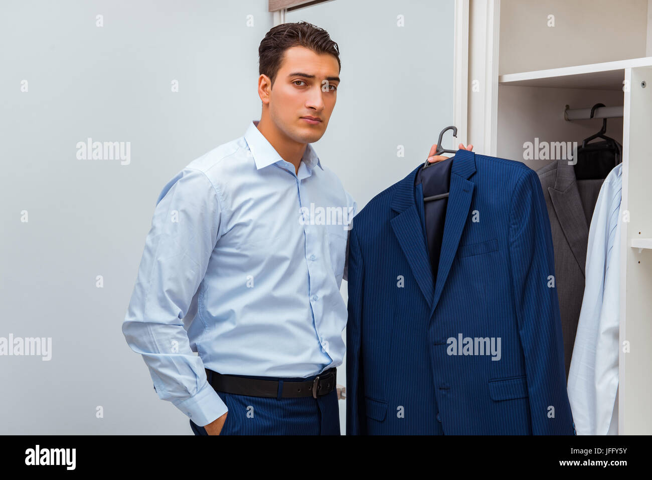Businessman dressing up for work Stock Photo - Alamy
