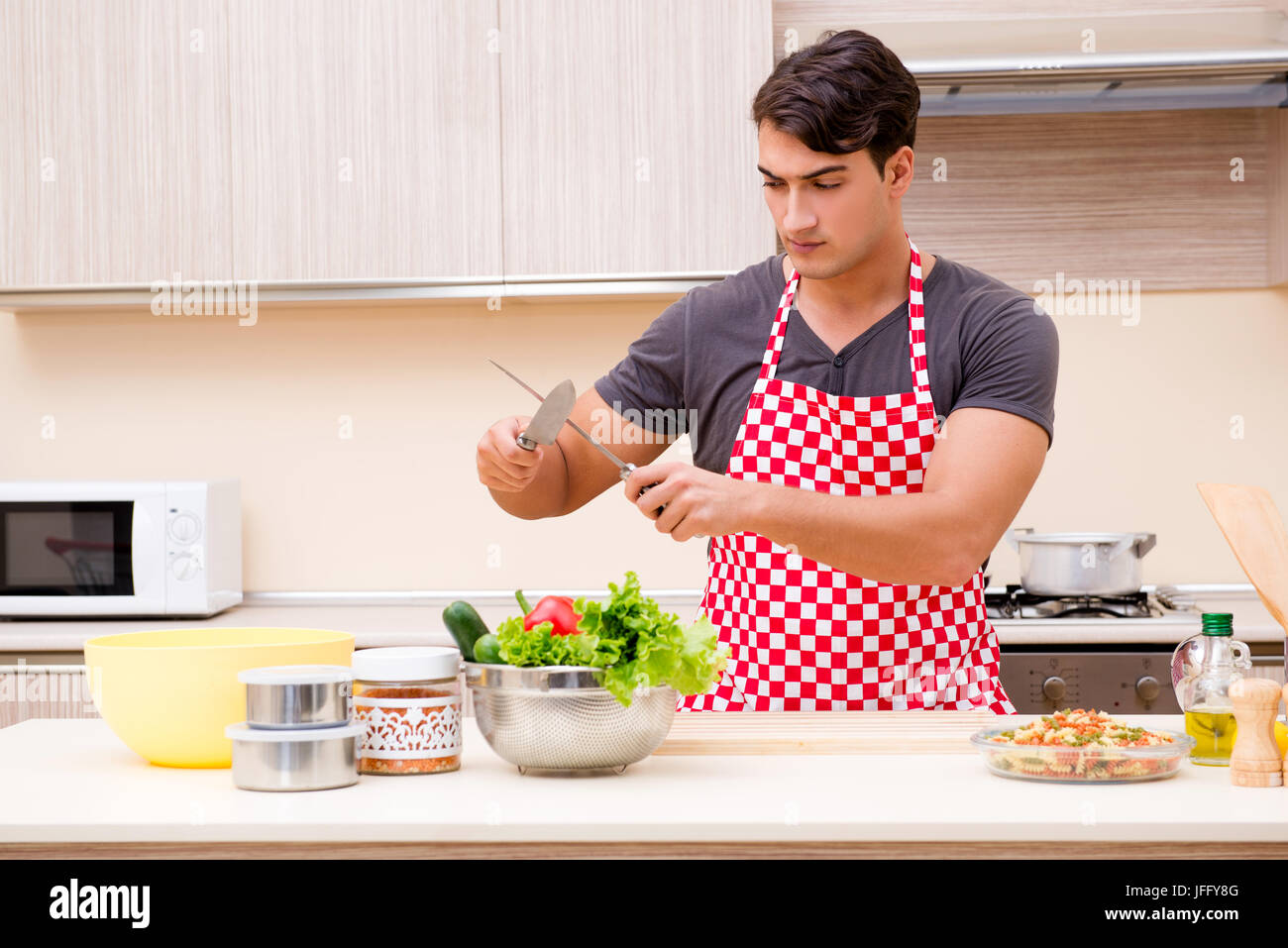 Man male cook preparing food in kitchen Stock Photo - Alamy