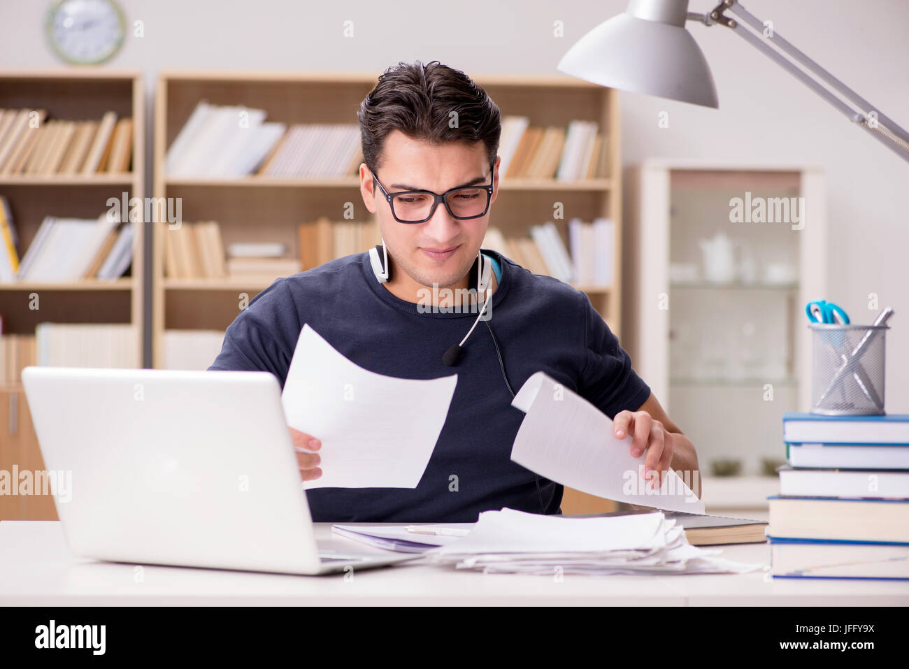 Angry man with too much paperwork to do Stock Photo - Alamy