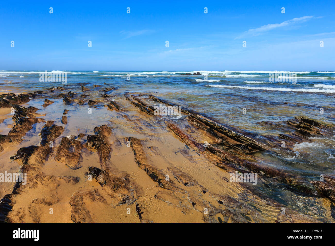 Rock formations on sandy beach (Portugal Stock Photo - Alamy