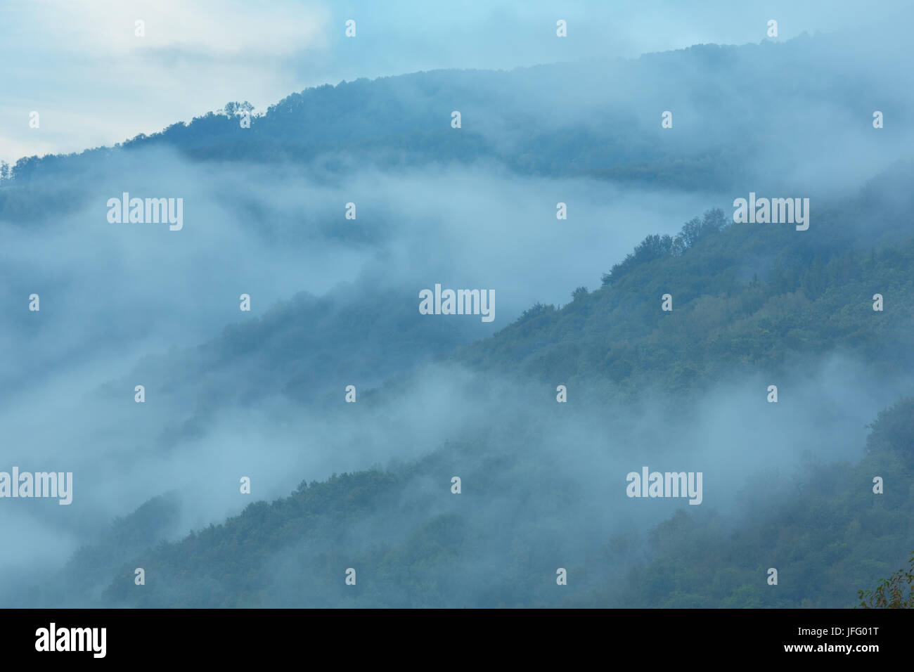 Evening mist in mountain Stock Photo - Alamy