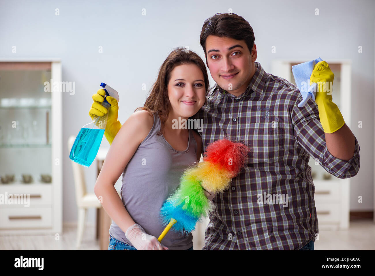 Wife and husband doing cleaning at home Stock Photo - Alamy