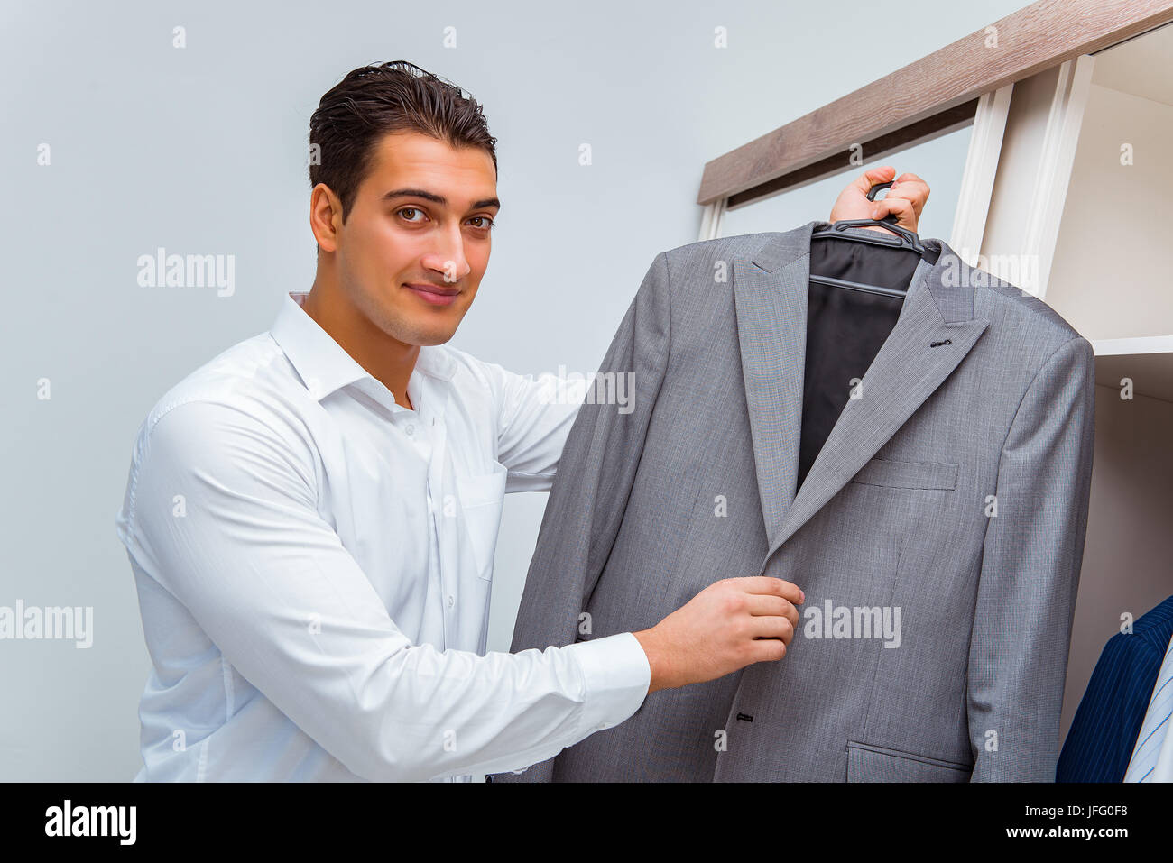 Businessman dressing up for work Stock Photo - Alamy