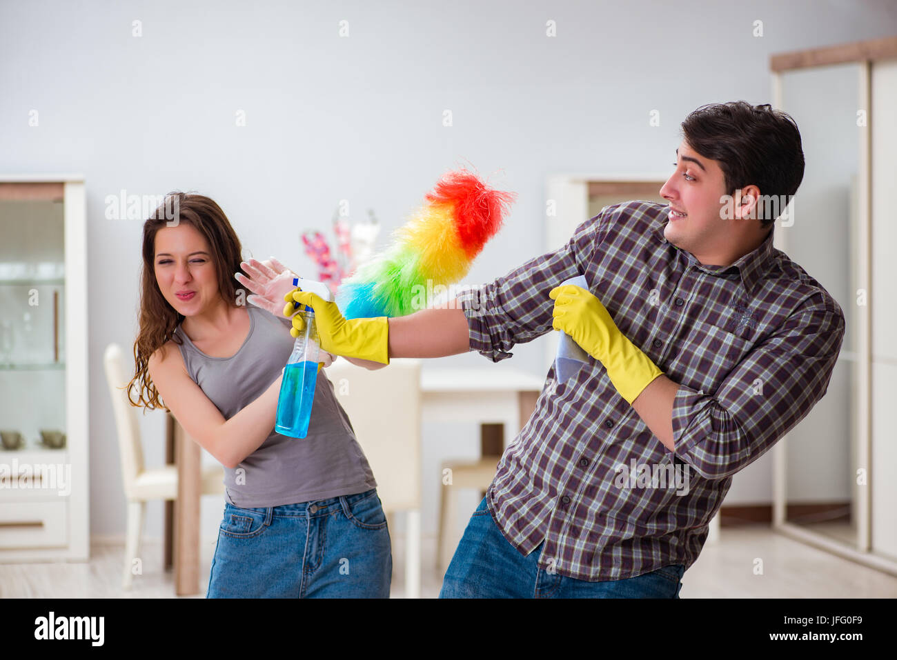 Wife and husband doing cleaning at home Stock Photo - Alamy