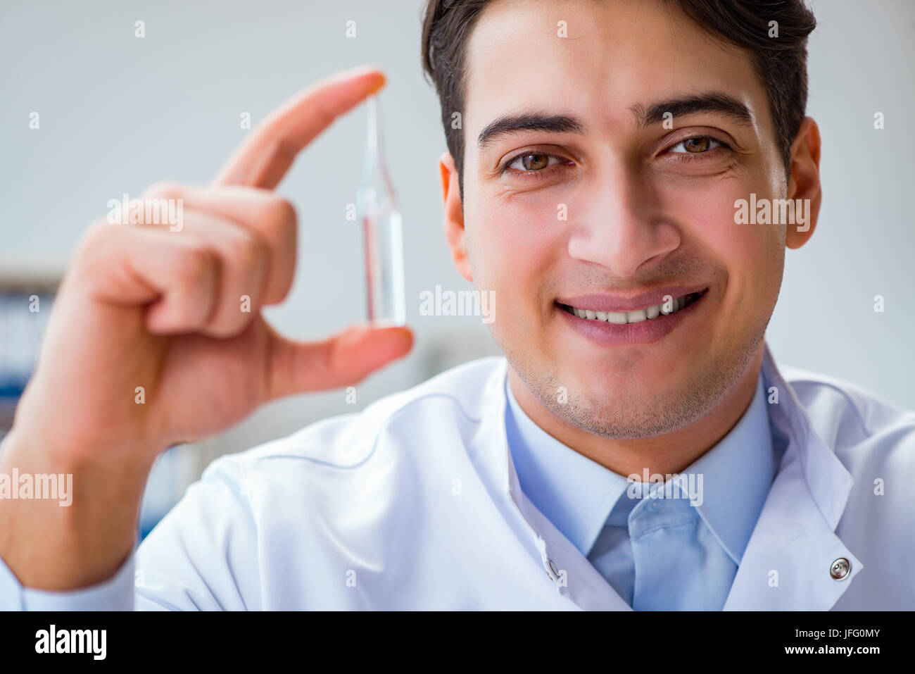 Doctor holding medicines in the lab Stock Photo - Alamy