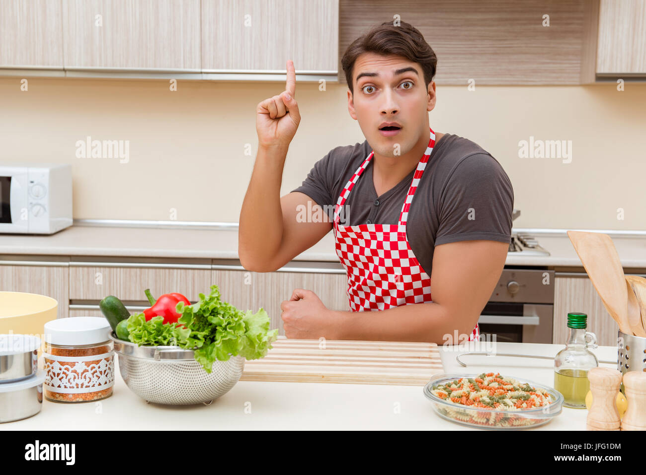 Man male cook preparing food in kitchen Stock Photo - Alamy
