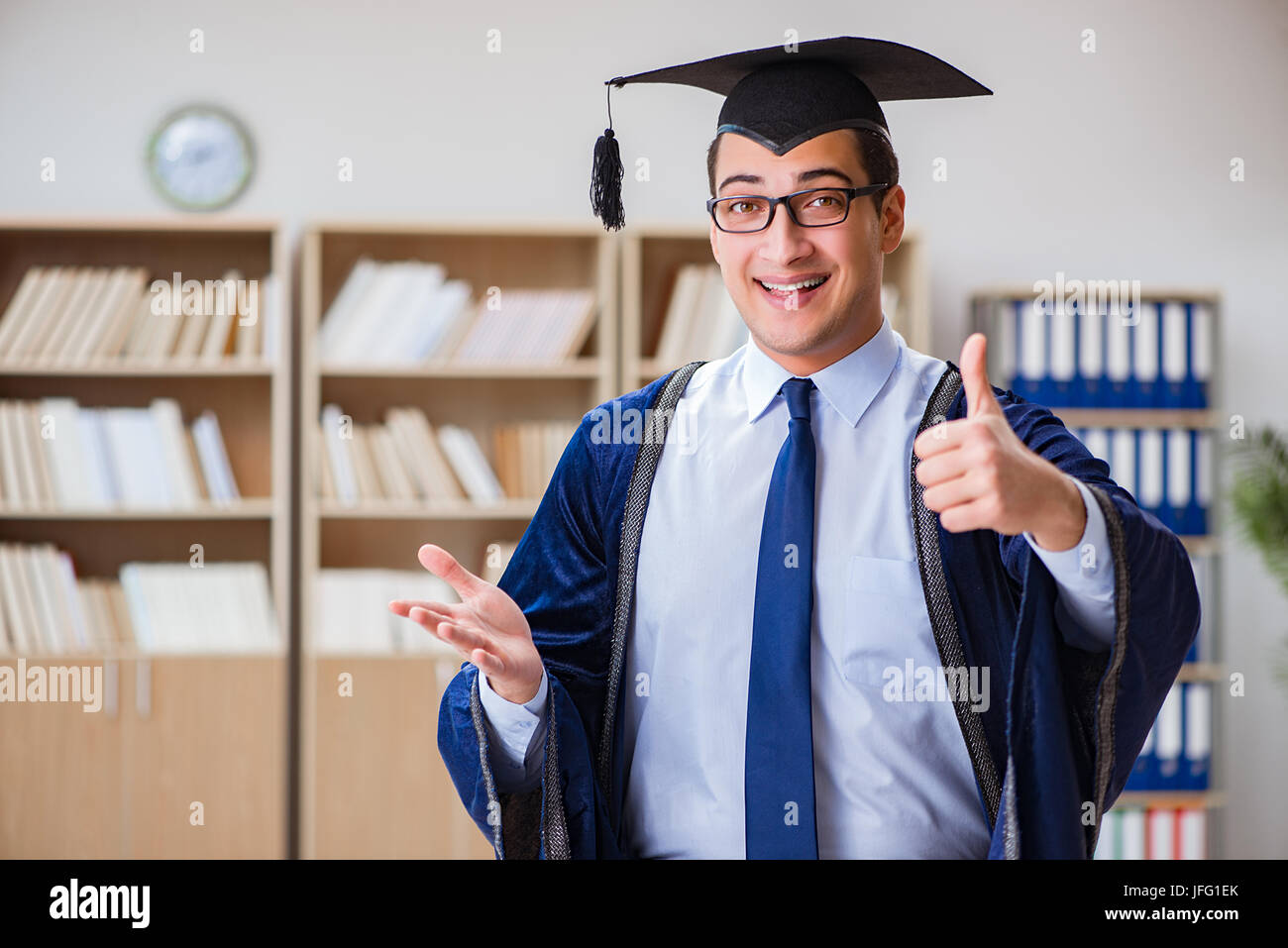 Young man graduating from university Stock Photo - Alamy