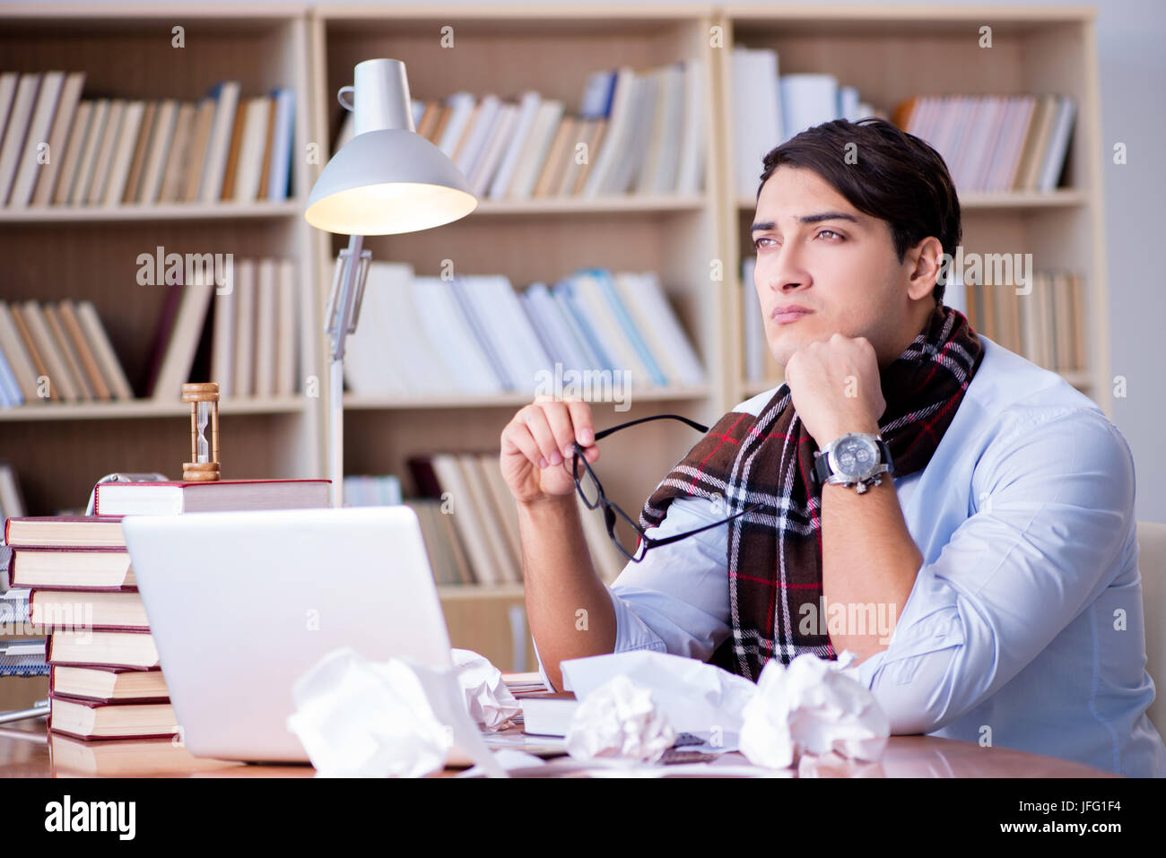 Young writer working in the library Stock Photo - Alamy