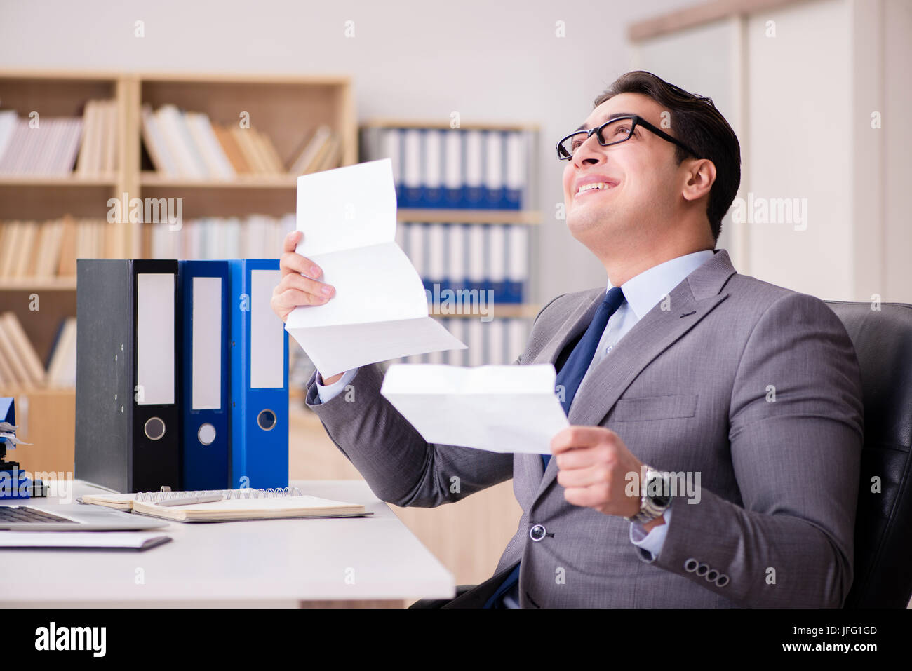 Businessman receiving letter in the office Stock Photo - Alamy