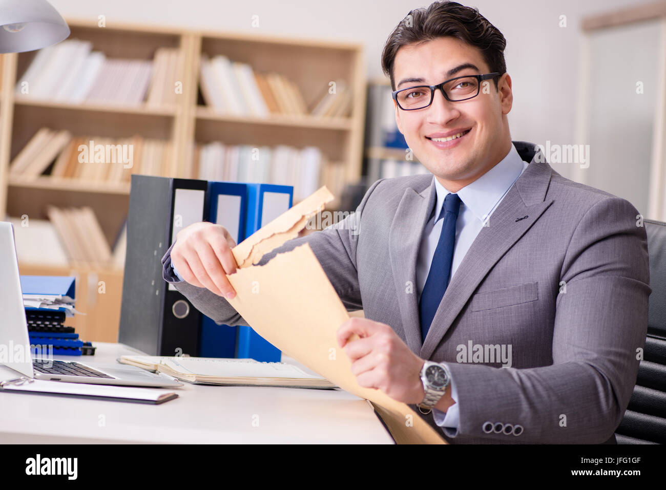Businessman receiving letter in the office Stock Photo - Alamy