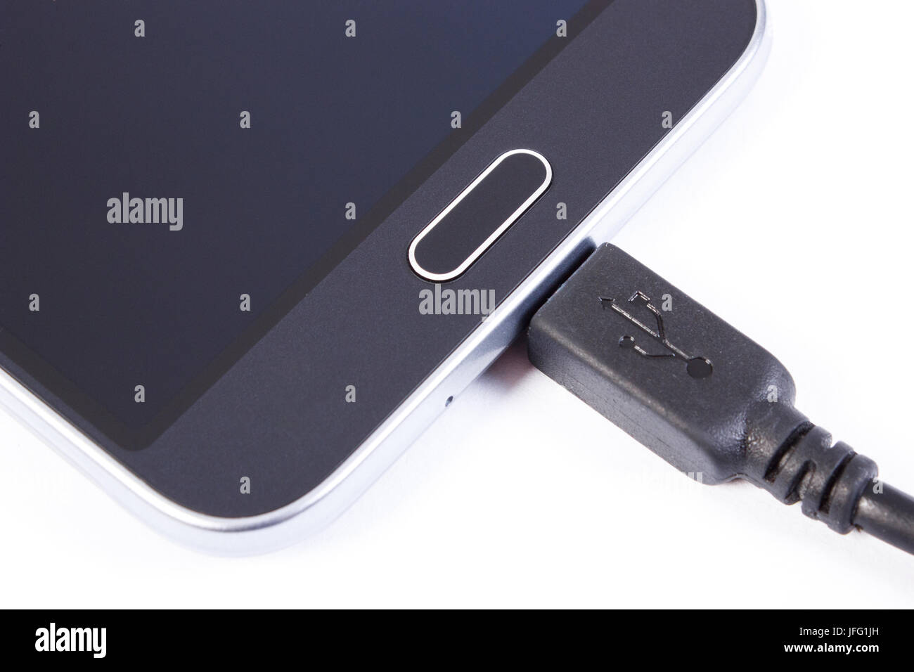 Mobile phone with connected plug of charger, smartphone charging, white ...