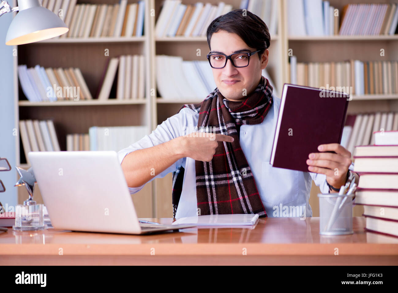Young writer working in the library Stock Photo - Alamy
