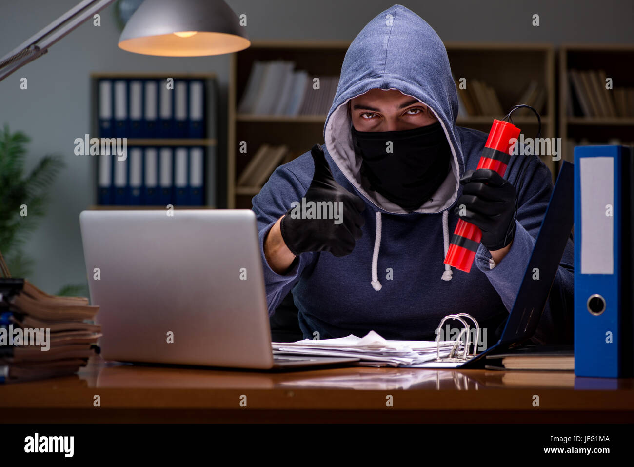 Hacker with dynamite stealing data Stock Photo - Alamy