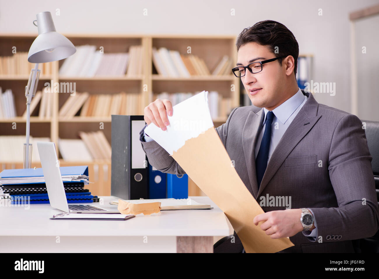 Businessman receiving letter in the office Stock Photo - Alamy
