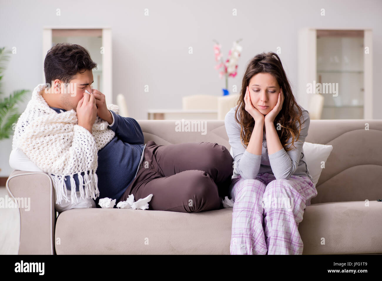 Wife caring for sick husband at home Stock Photo - Alamy
