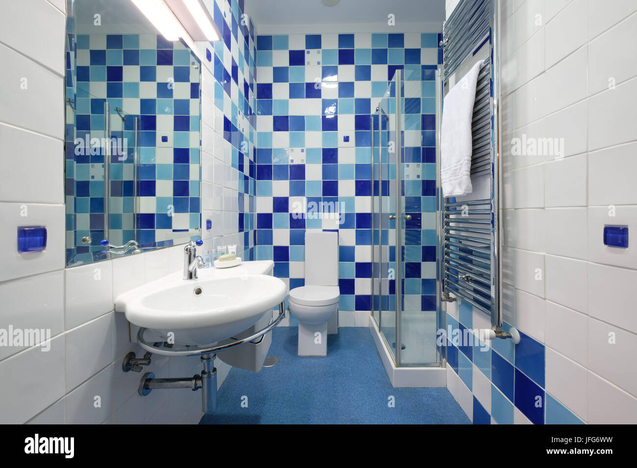 Modern bathroom with blue tiles Stock Photo - Alamy
