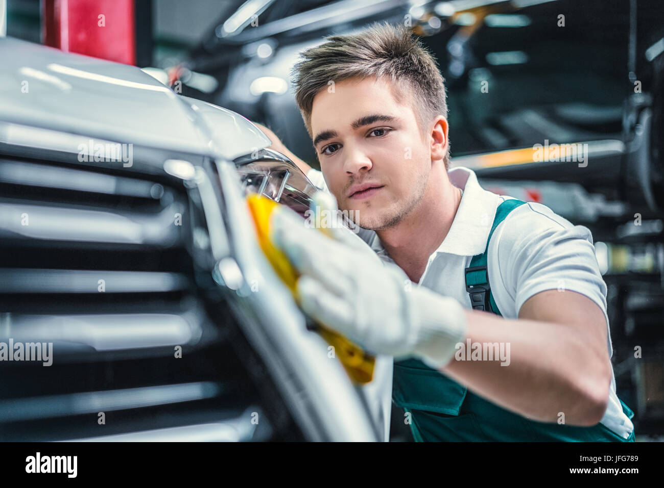 Man in garage Stock Photo - Alamy