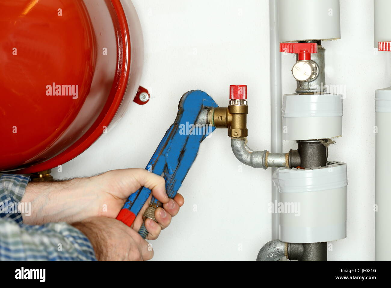 worker repairs a water pipe Stock Photo - Alamy