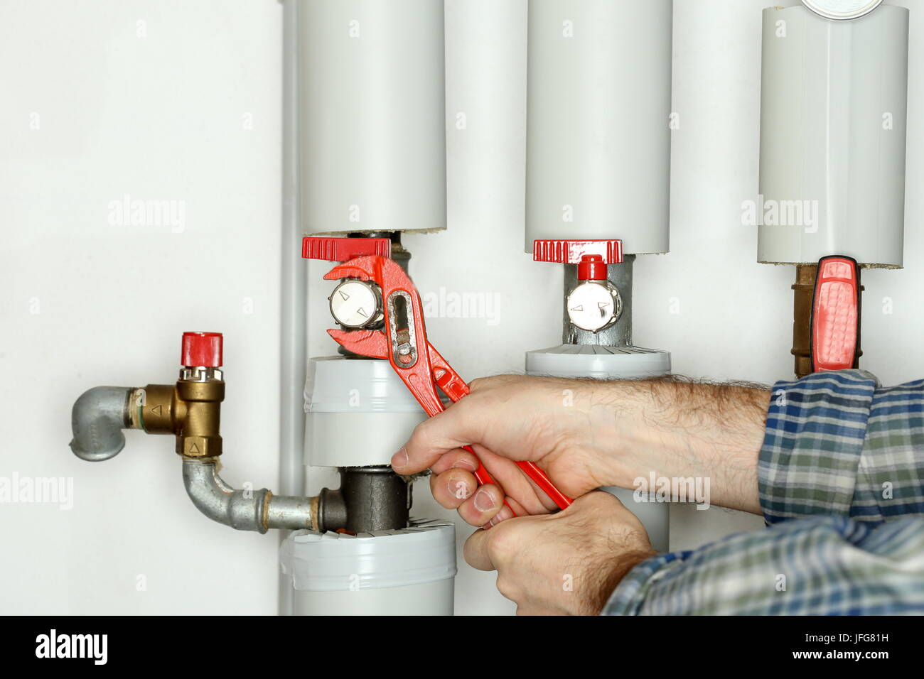 worker is fixing a valve Stock Photo - Alamy