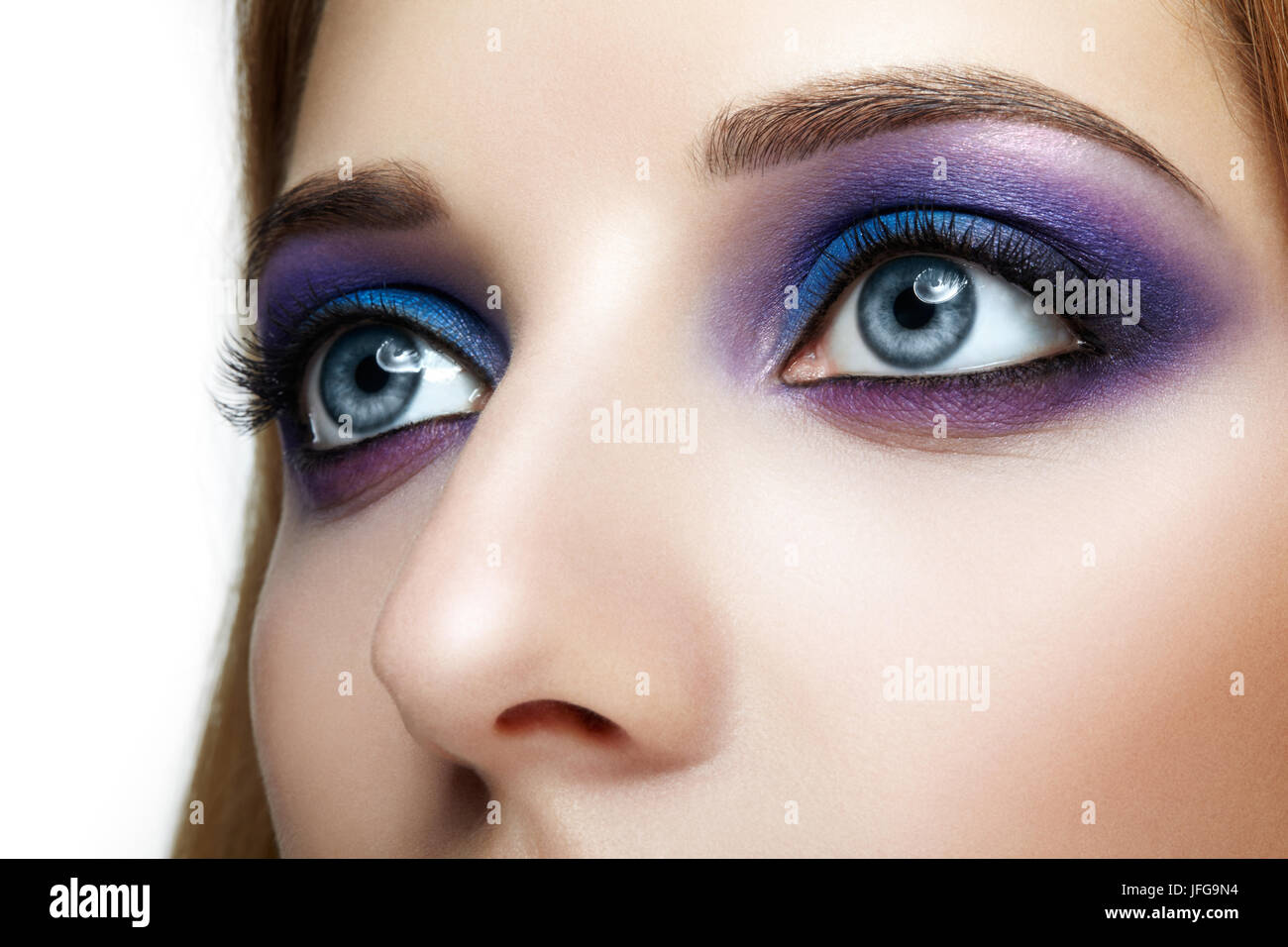 Female face eye with blue and violet makeup Stock Photo - Alamy