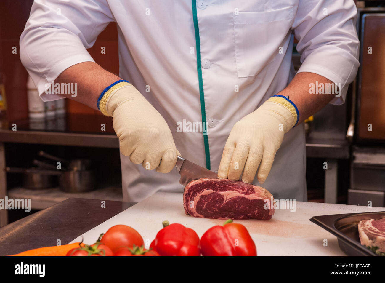 Chef cutting meat Stock Photo - Alamy