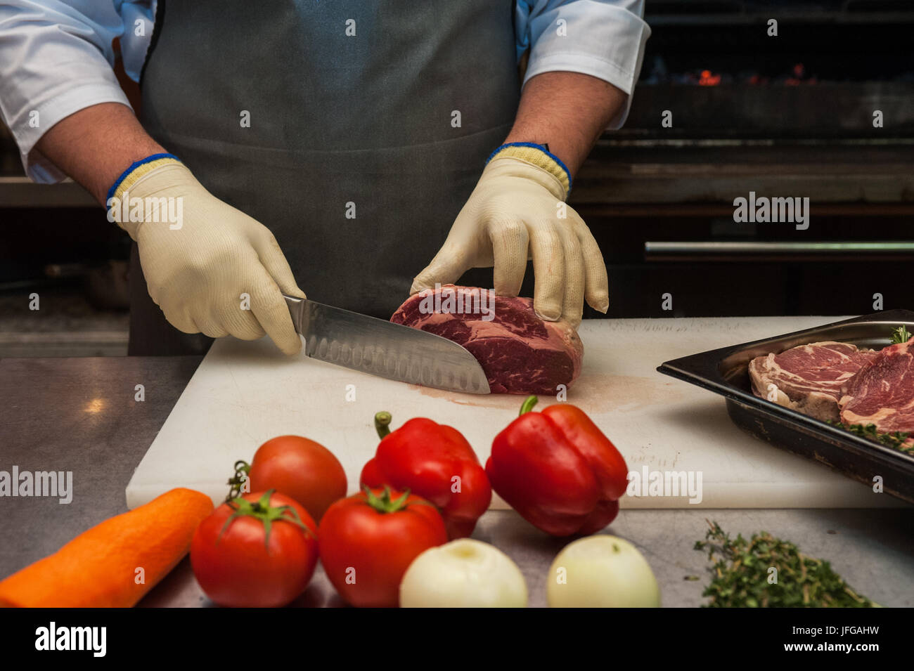 Chef cutting meat Stock Photo - Alamy