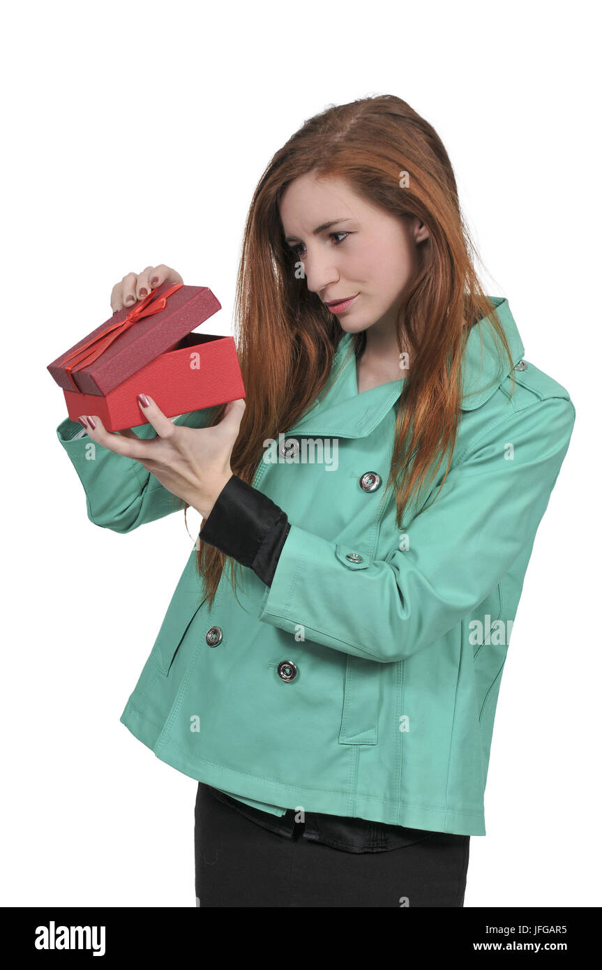 Beautiful woman opening a present Stock Photo - Alamy