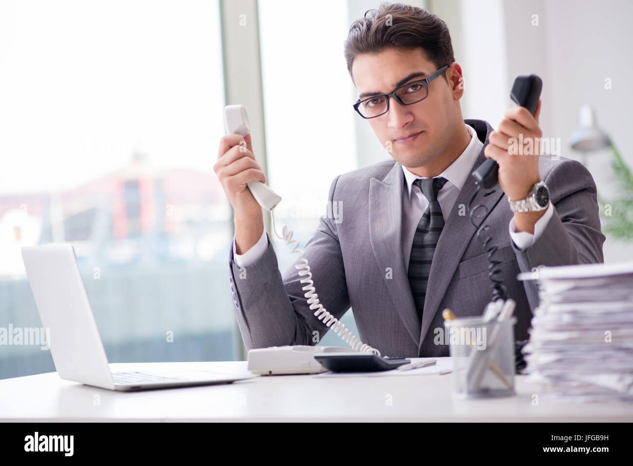 Angry helpdesk operator yelling in office Stock Photo - Alamy