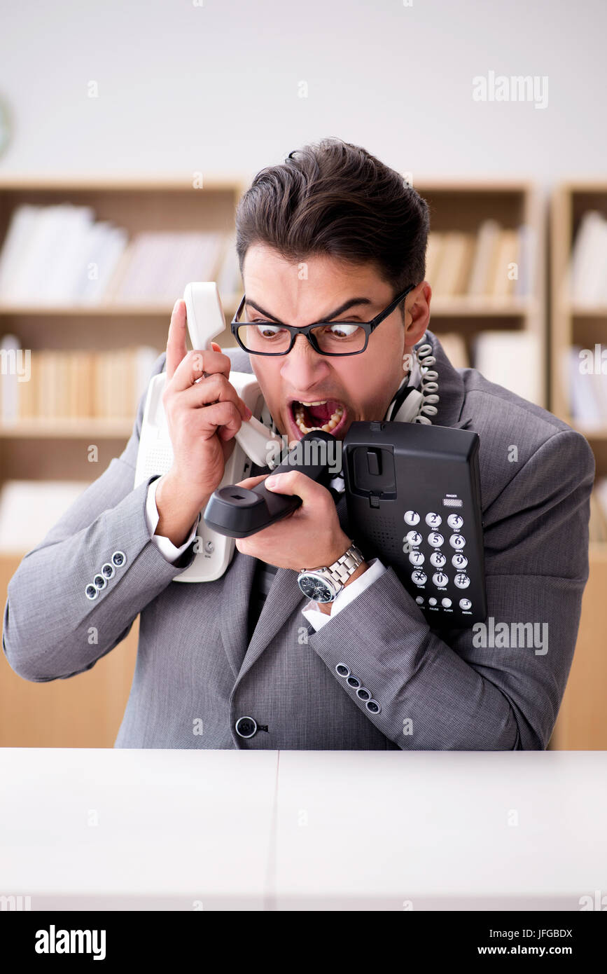 Angry helpdesk operator yelling in office Stock Photo - Alamy