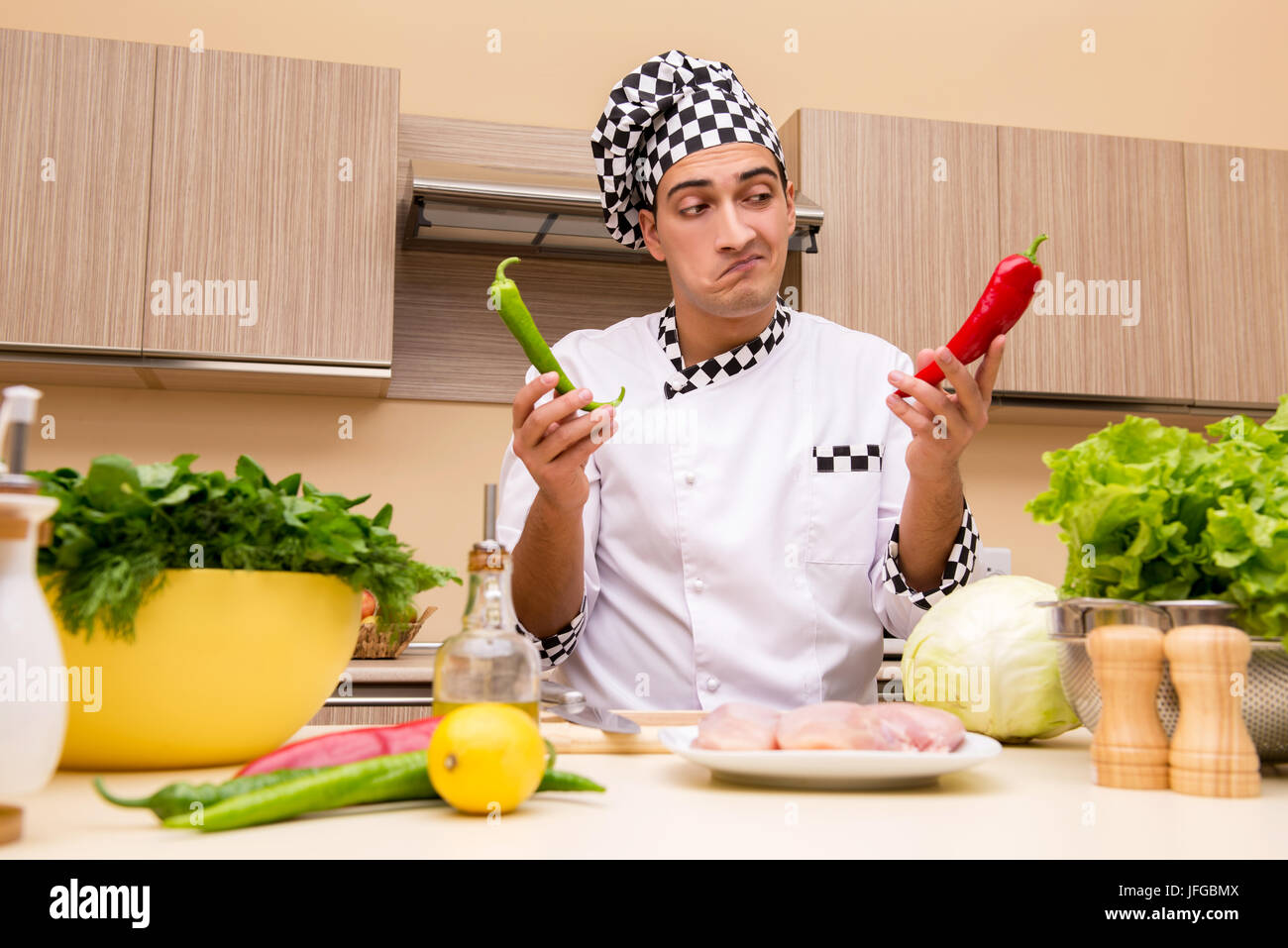 Young chef working in the kitchen Stock Photo - Alamy