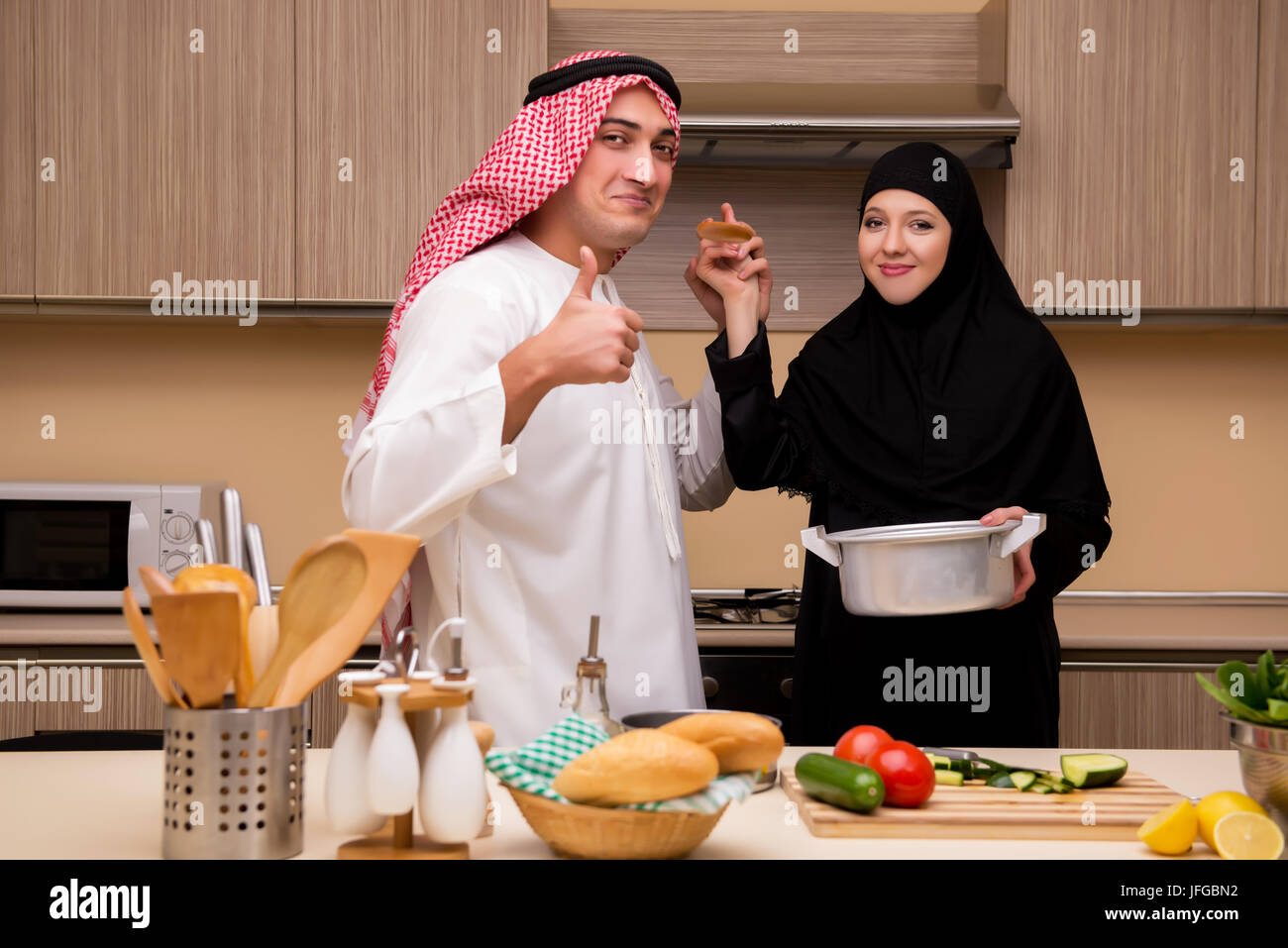 Young arab family in the kitchen Stock Photo - Alamy