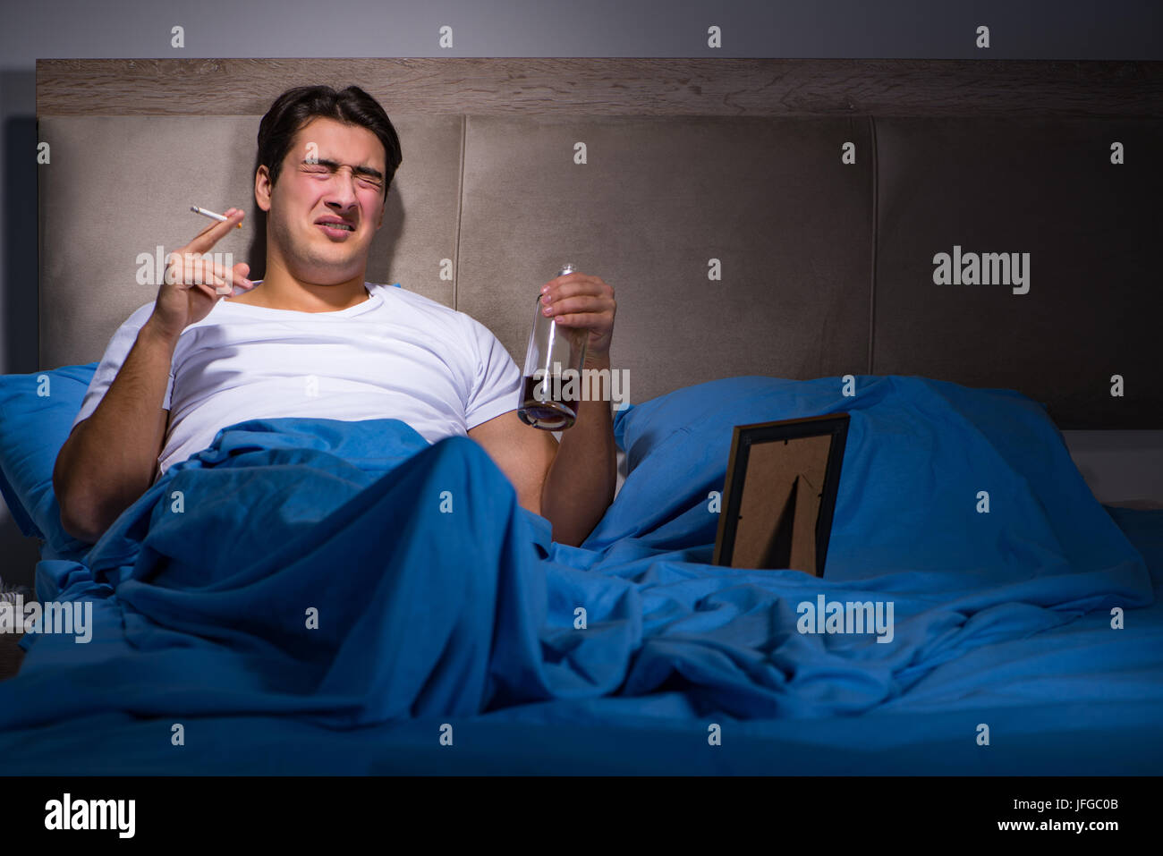 Man woman smoking in bed hi-res stock photography and images - Alamy