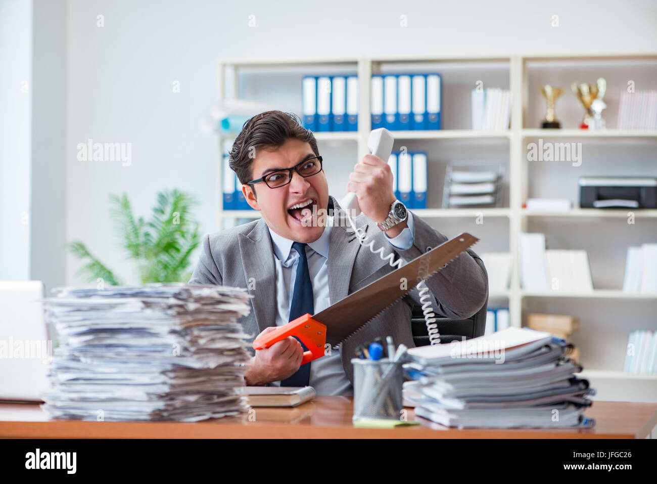 Angry aggressive businessman in the office Stock Photo - Alamy