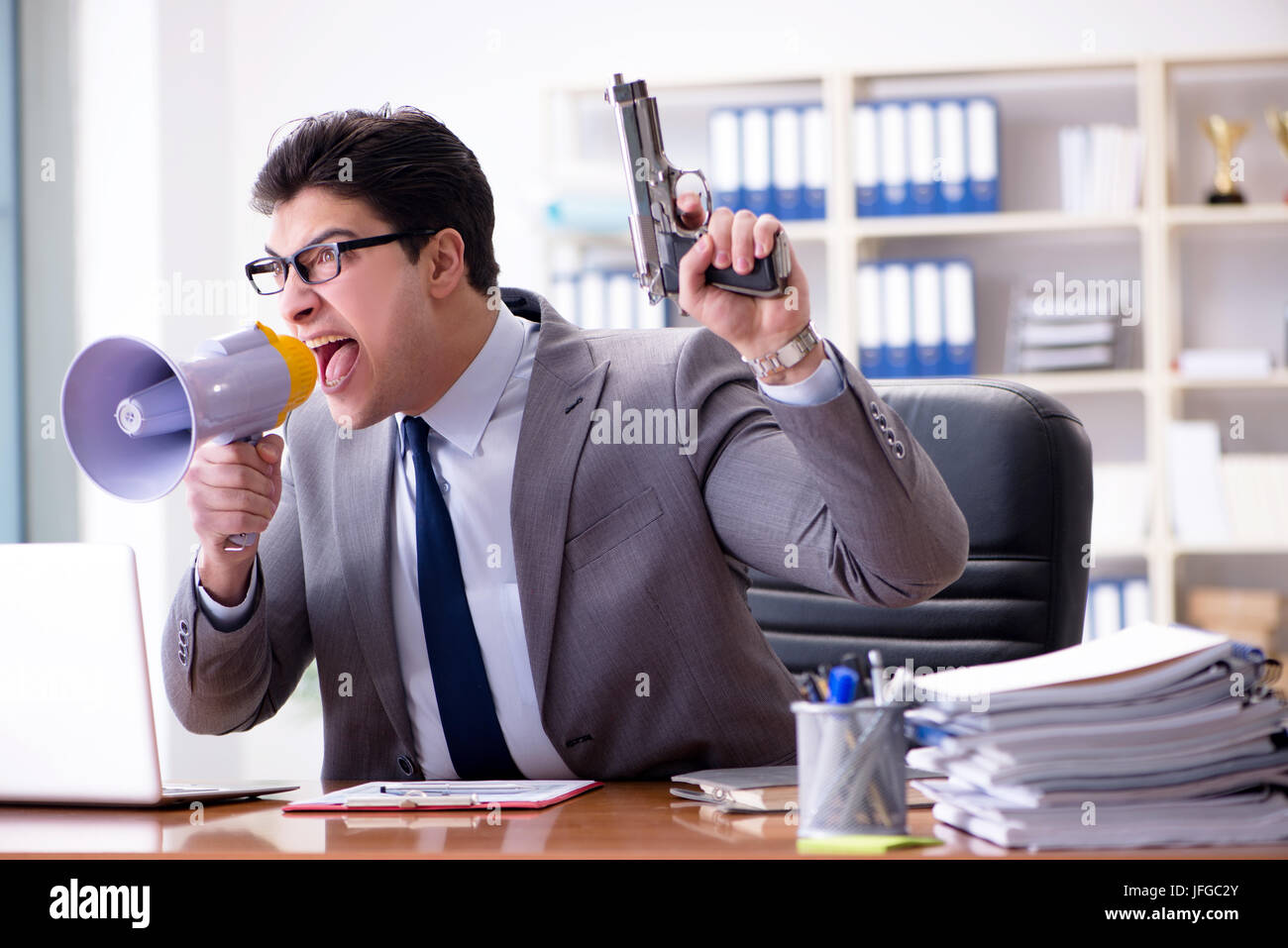 Angry aggressive businessman in the office Stock Photo - Alamy
