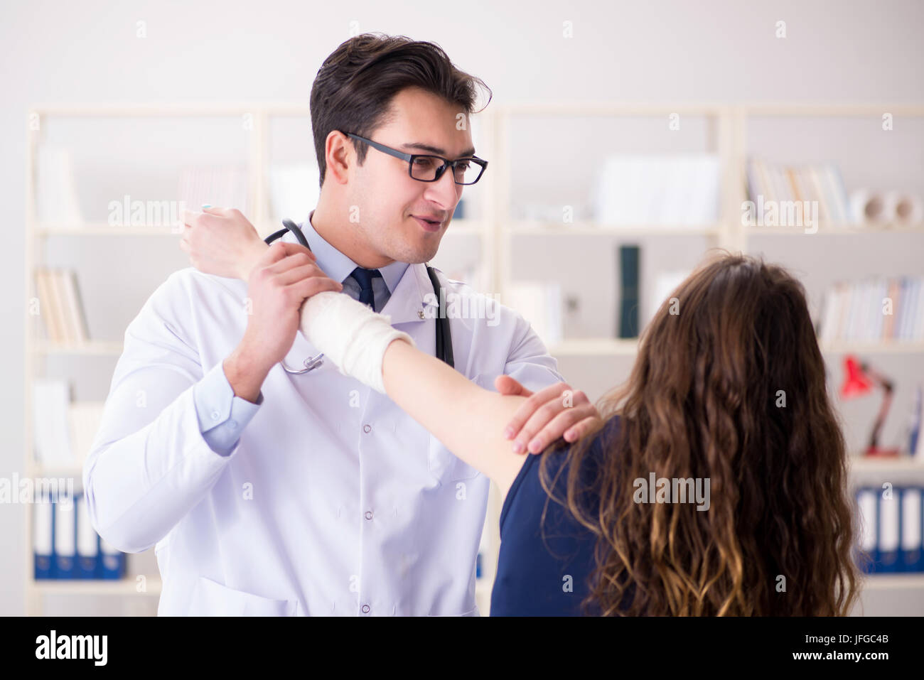 Traumatologist is taking care of the patient Stock Photo - Alamy