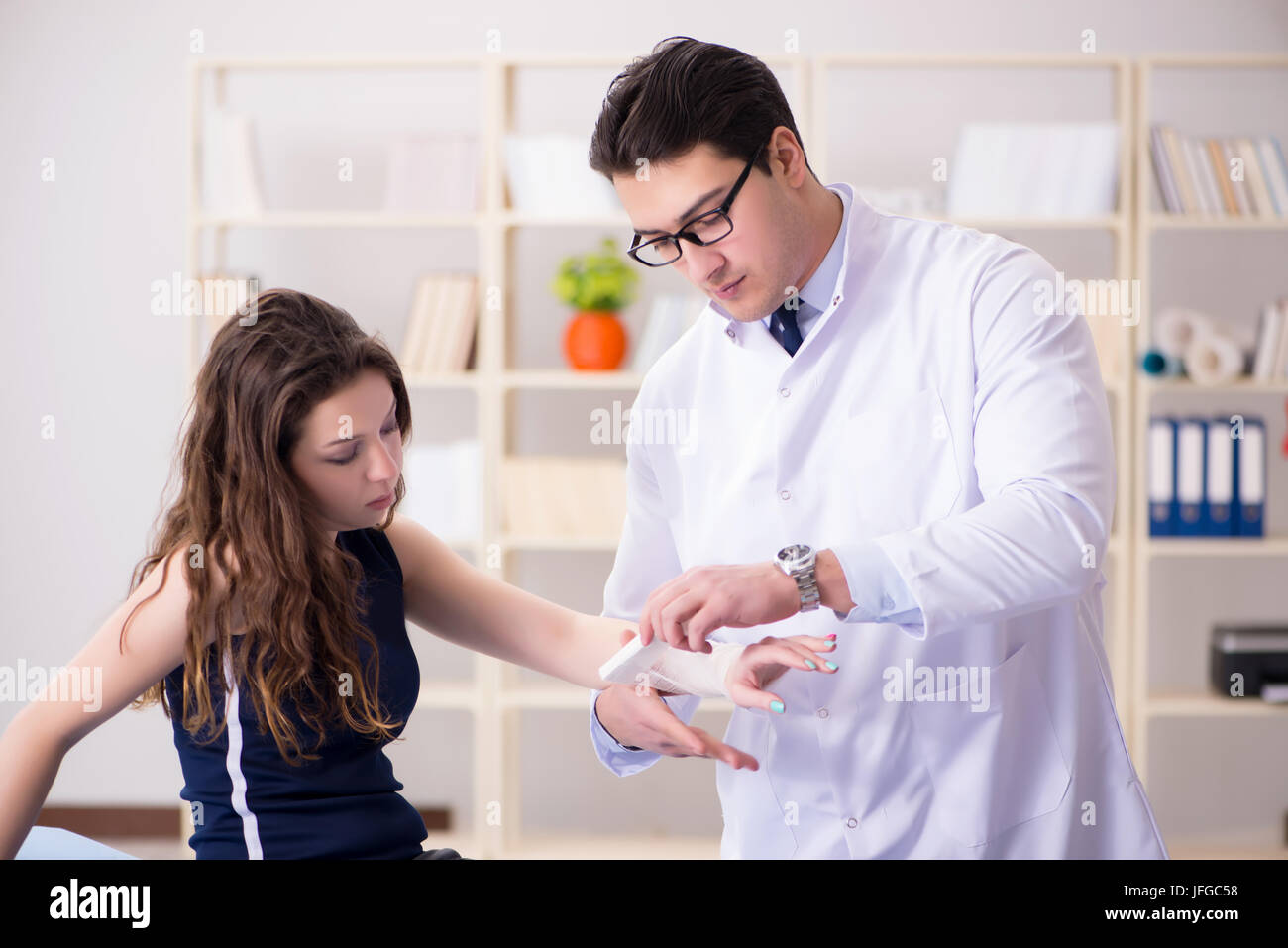 Traumatologist is taking care of the patient Stock Photo - Alamy