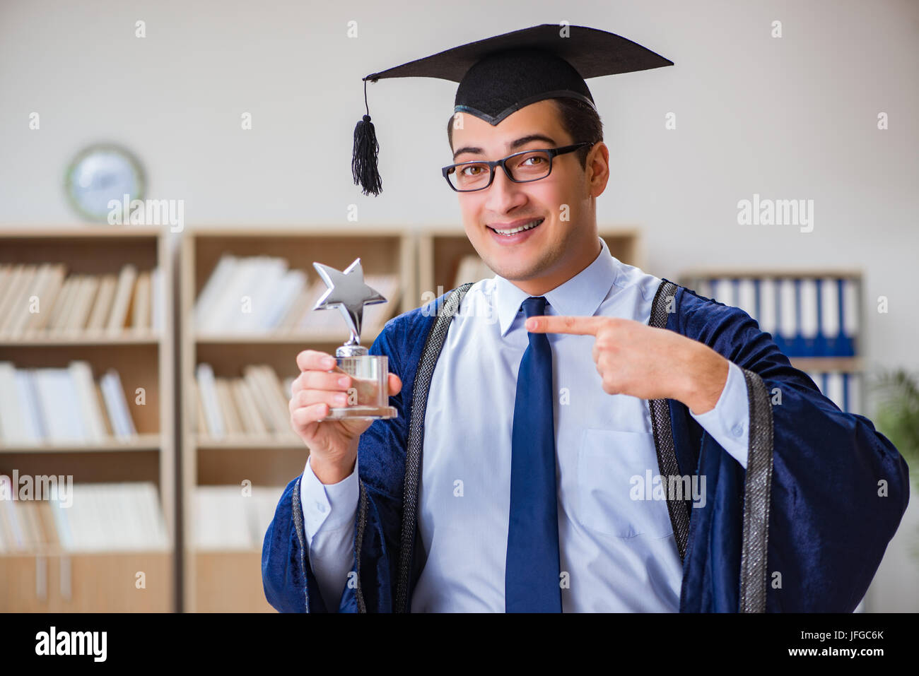 Young man graduating from university Stock Photo - Alamy