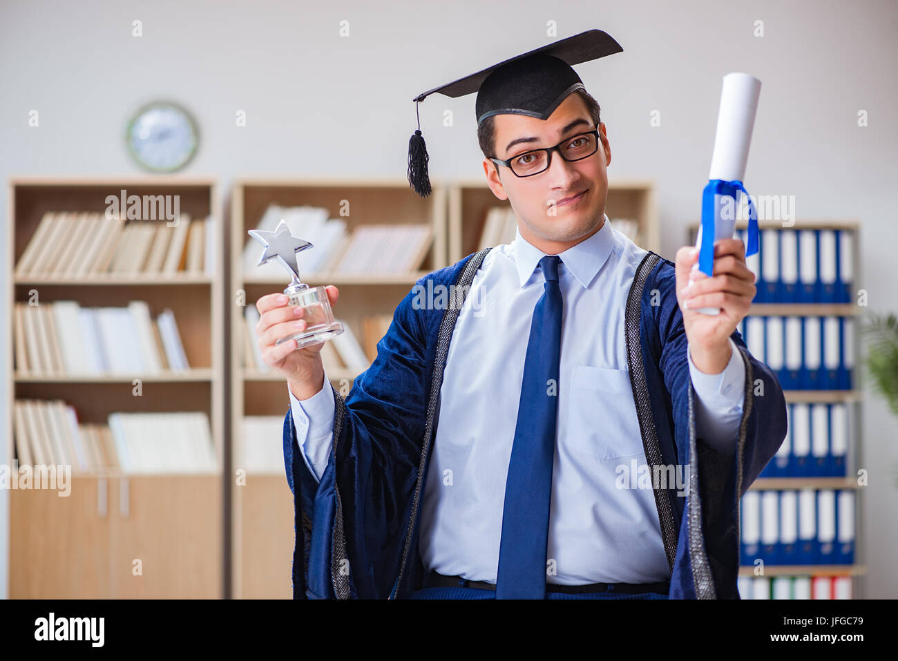 Young man graduating from university Stock Photo - Alamy